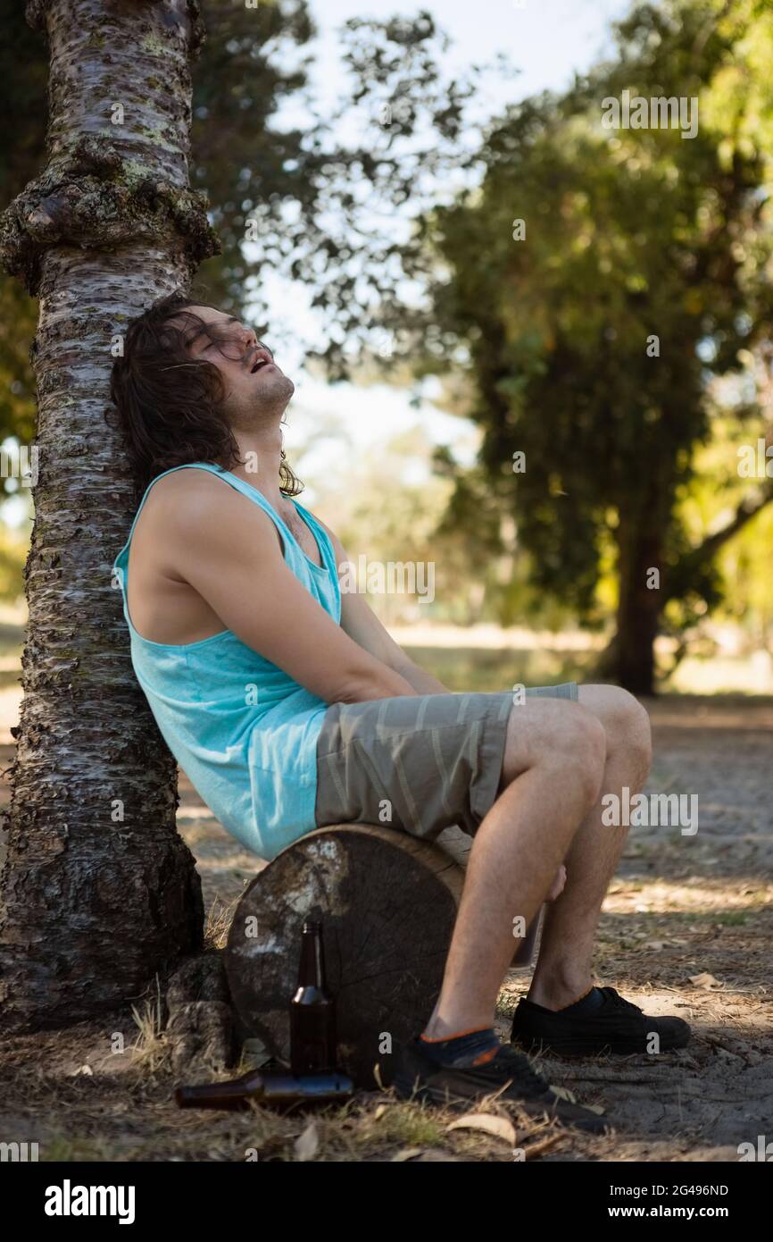 Unconscious man sleeping in the park Stock Photo - Alamy