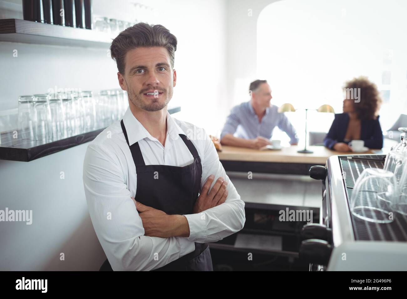 Woman standing counter folded hi-res stock photography and images - Alamy