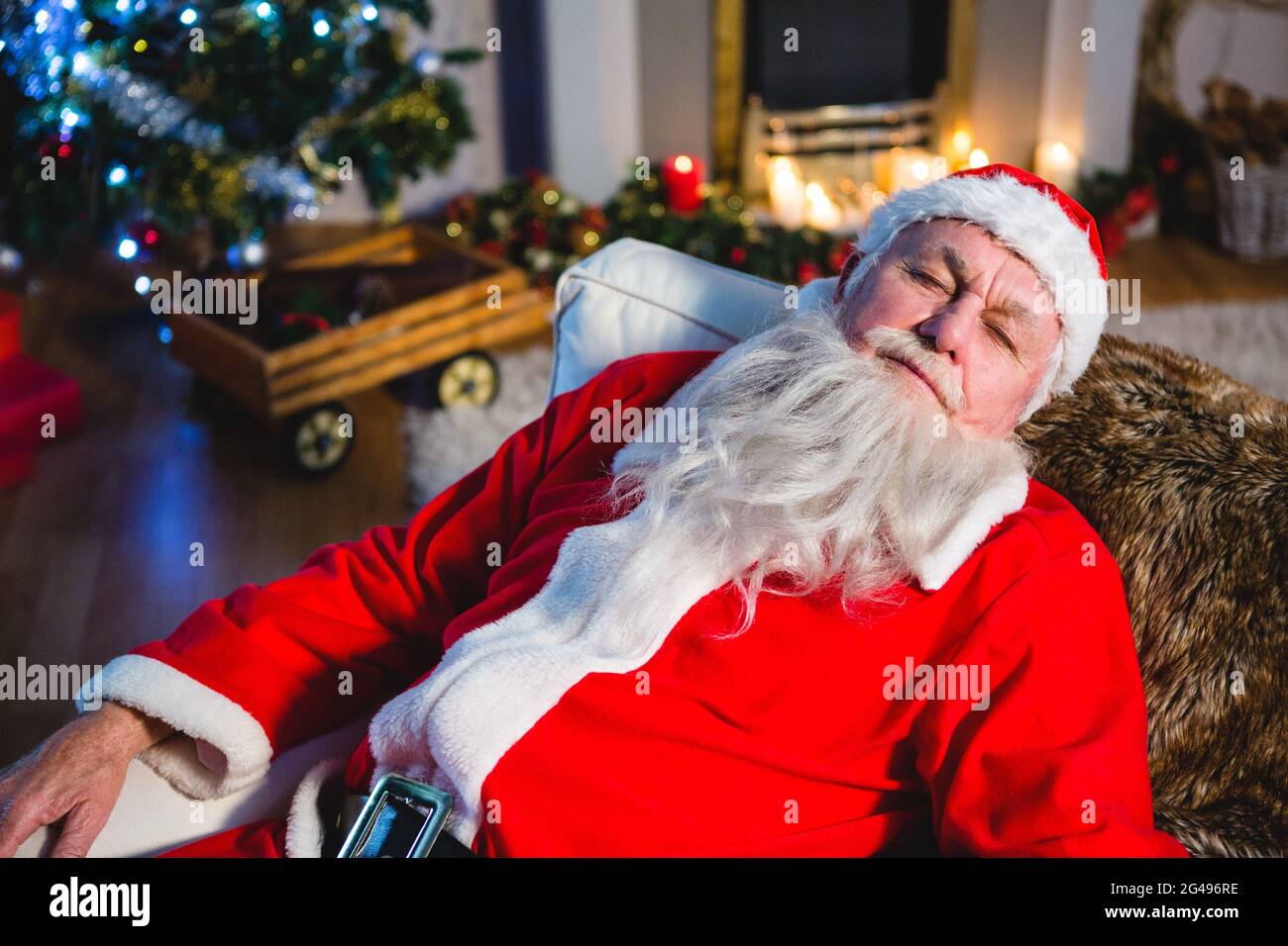 Santa Claus sleeping on couch Stock Photo - Alamy