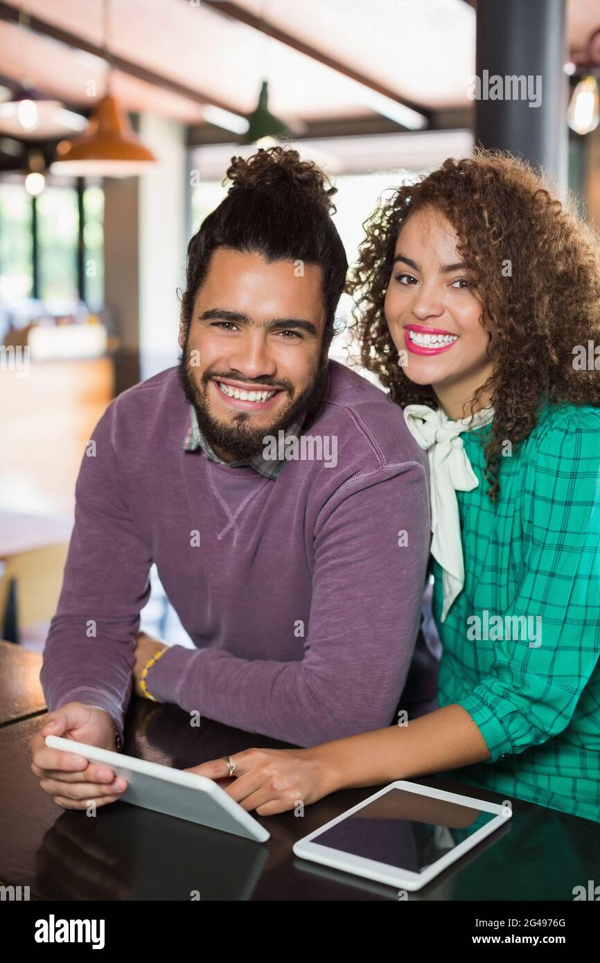 Two friends using tablets hi-res stock photography and images - Alamy