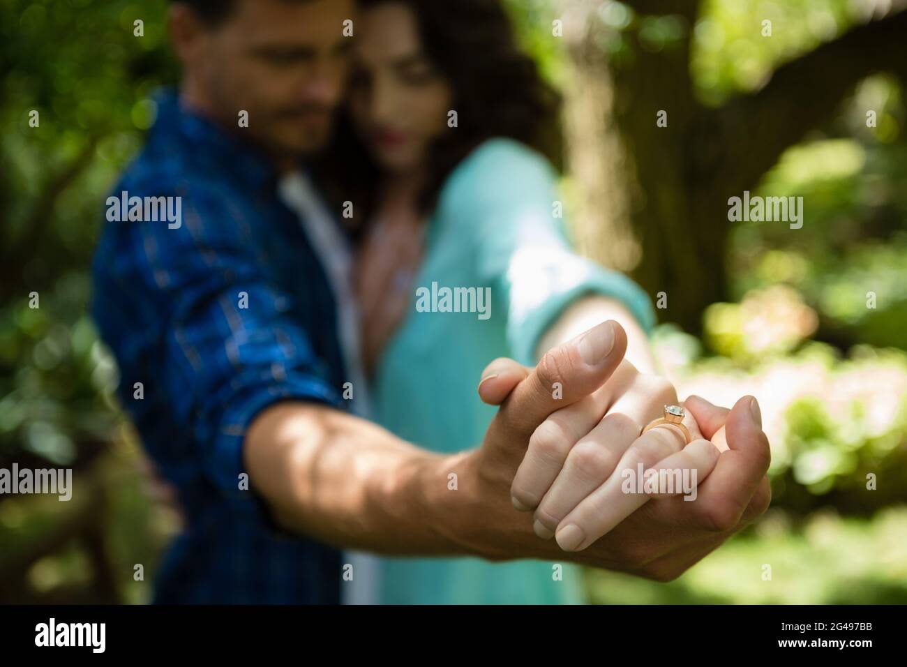 Romantic couple holding hand Stock Photo - Alamy