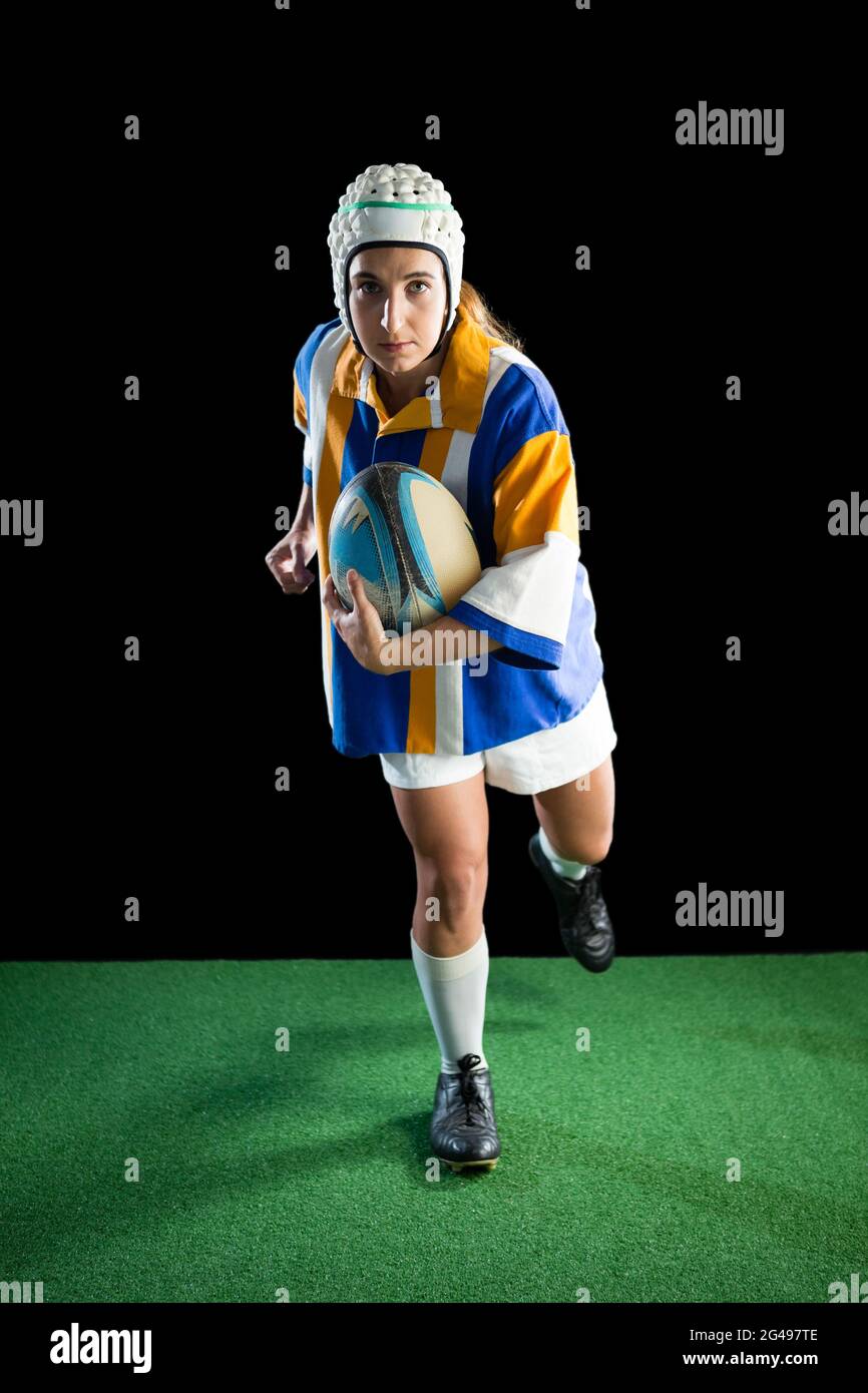 Portrait of female athlete wearing helmet while playing rugby Stock ...