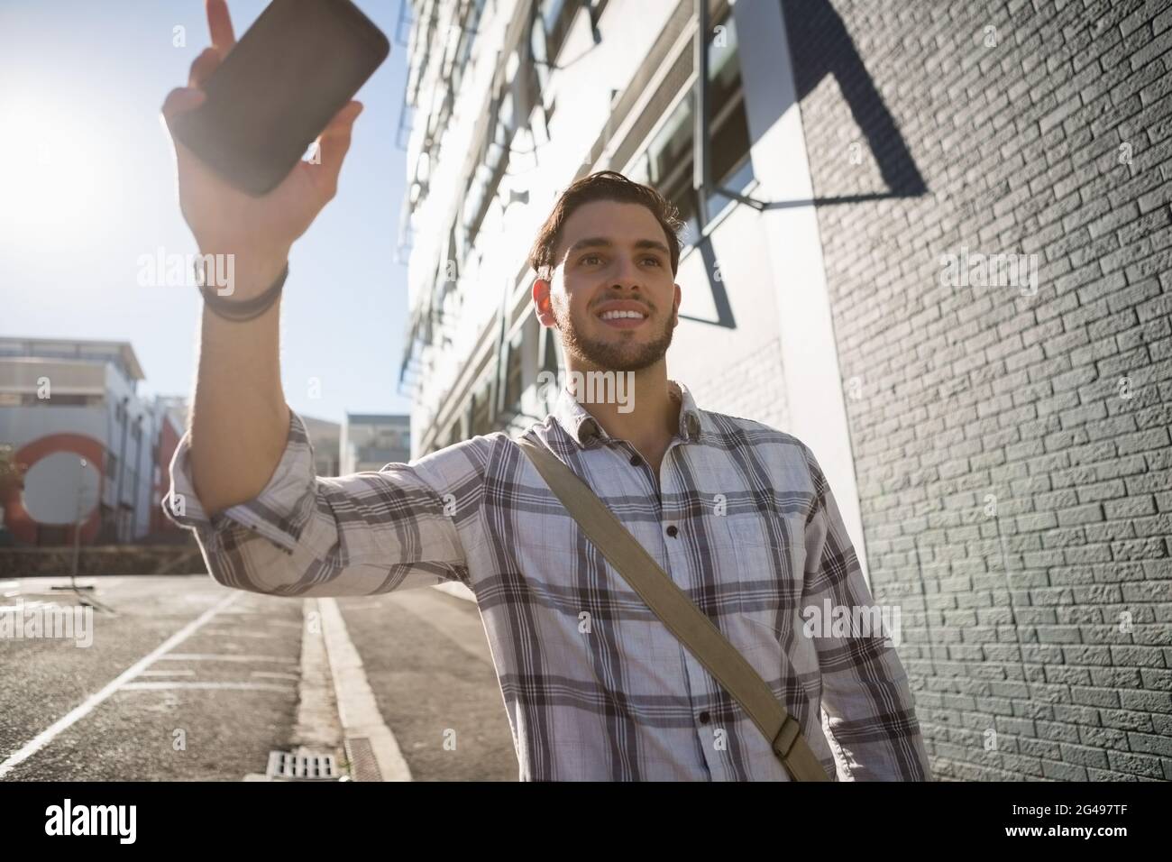 Smiling standing looking away gesturing hi-res stock photography and ...