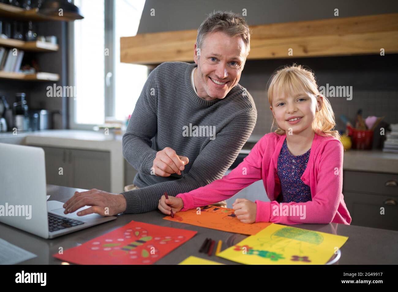 Father and daughter posing while coloring Stock Photo - Alamy