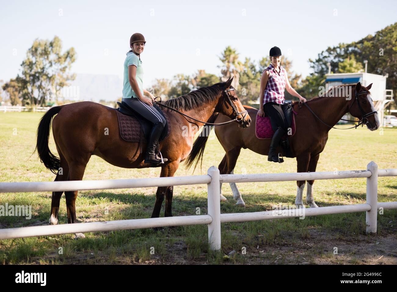Portrait female jockey standing horse hi-res stock photography and ...
