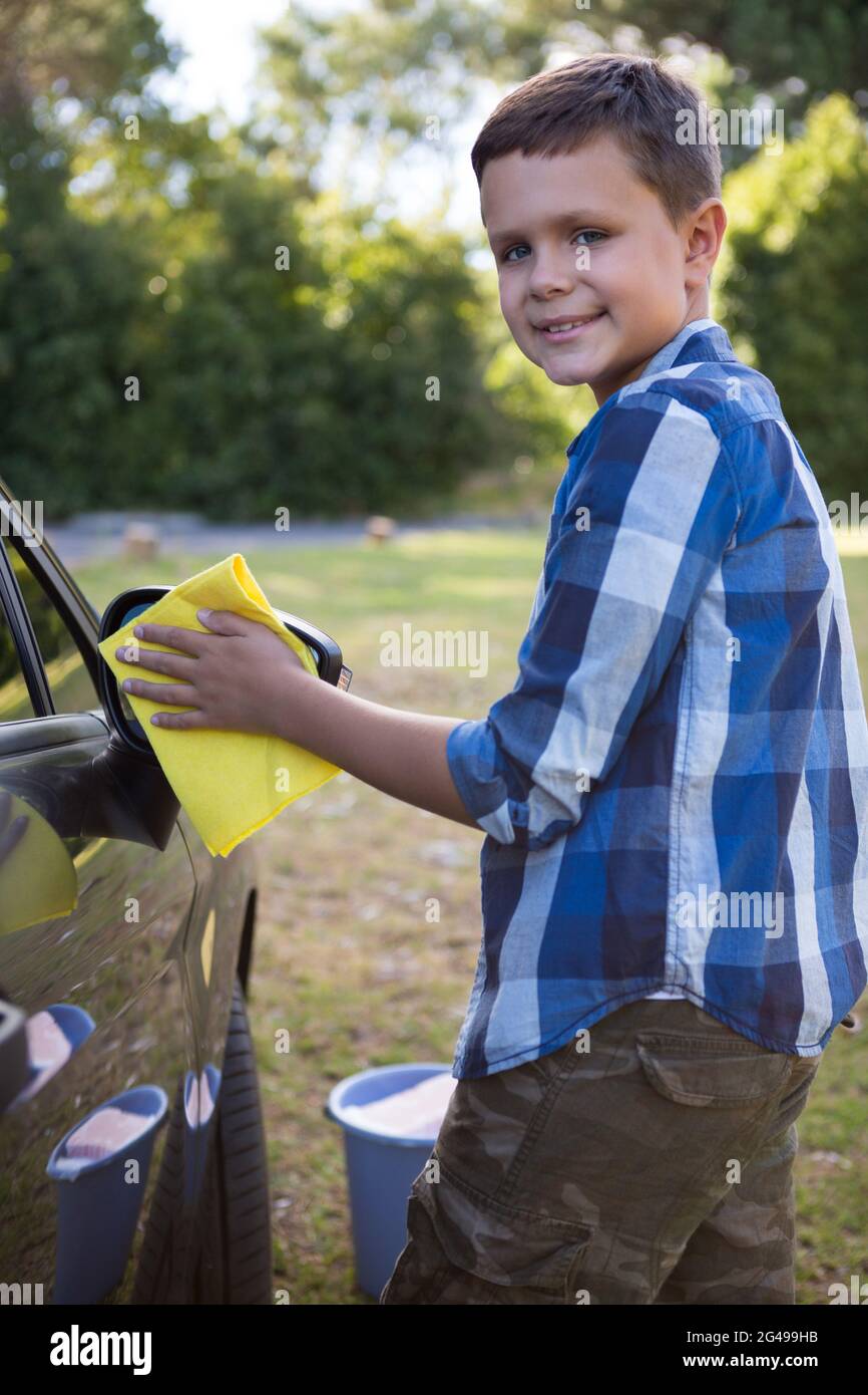 Teenage boy washing car hi-res stock photography and images - Alamy