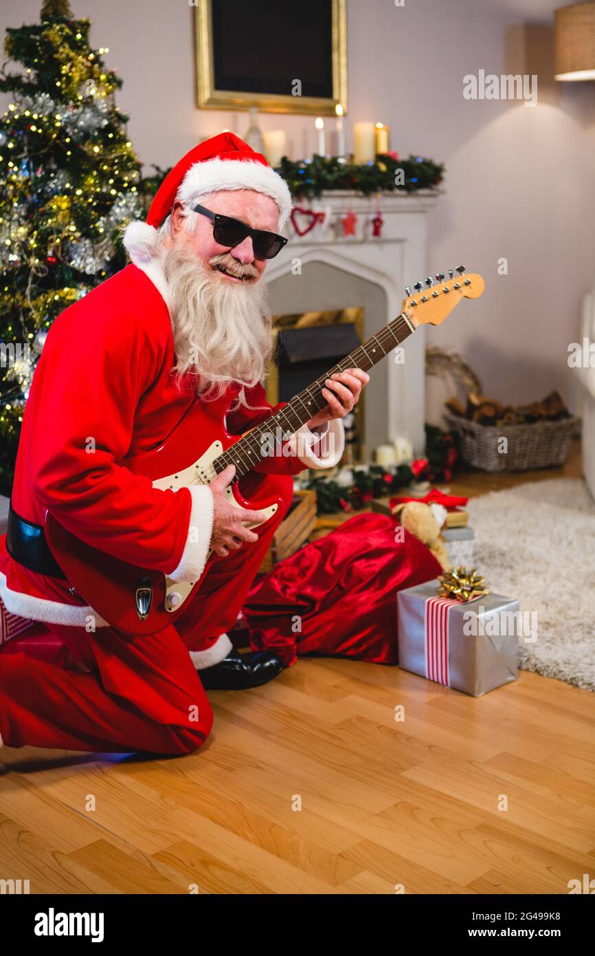 Guitar playing santa claus hi-res stock photography and images - Alamy