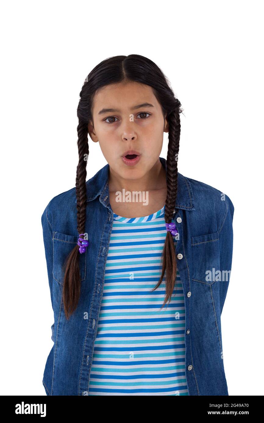 Cute girl surprised against white background Stock Photo - Alamy