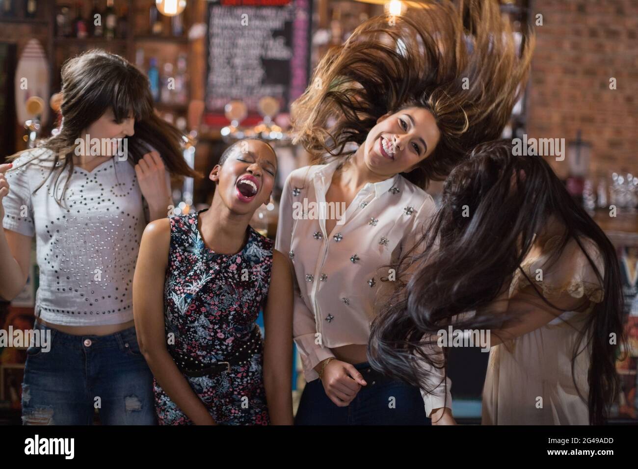 Four friends having fun dancing hi-res stock photography and images - Alamy