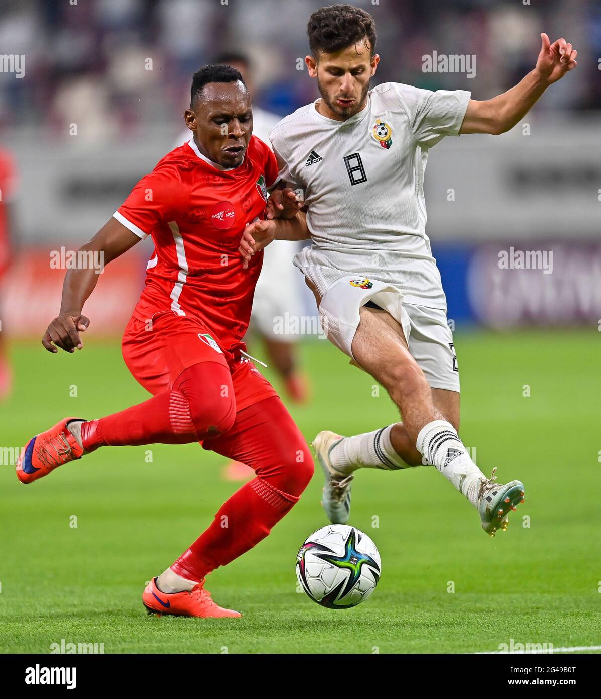 Doha, Qatar. 19th June, 2021. Samawal Merghani (L) of Sudan vies with ...