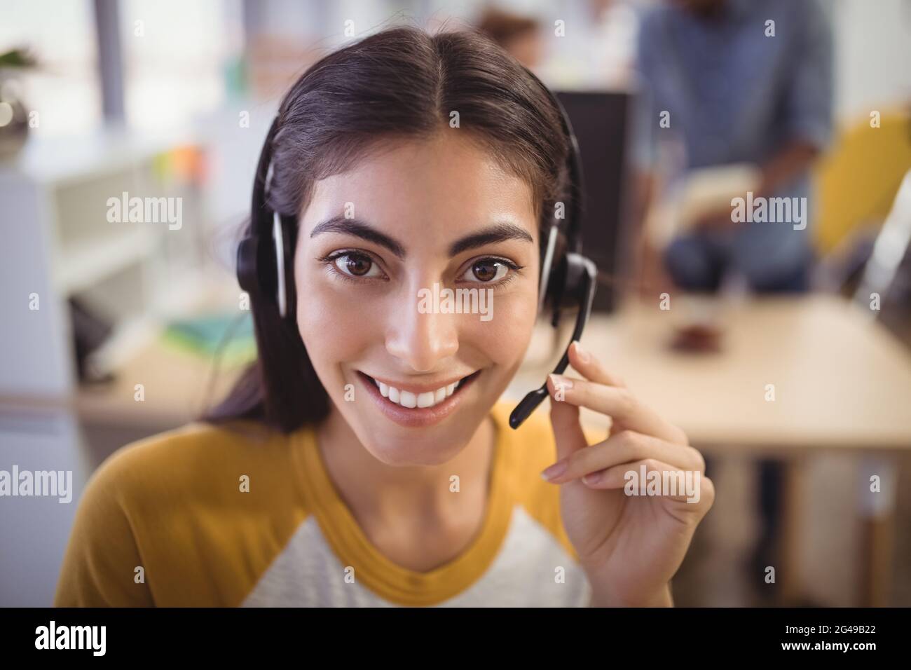 Customer service representative smiling camera hi-res stock photography ...