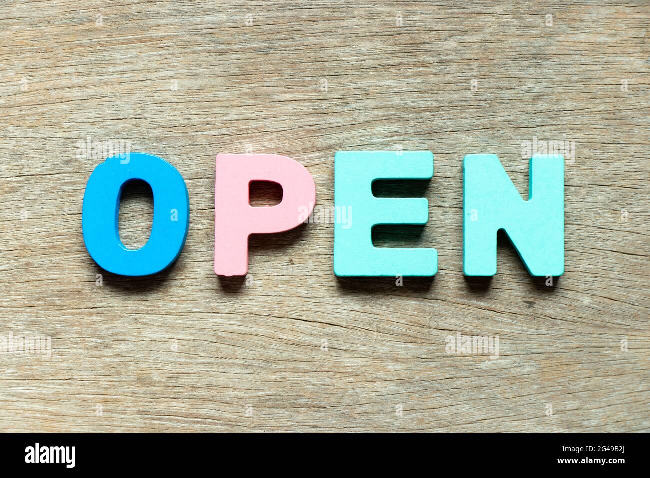 Color alphabet letter in word open on wood background Stock Photo - Alamy