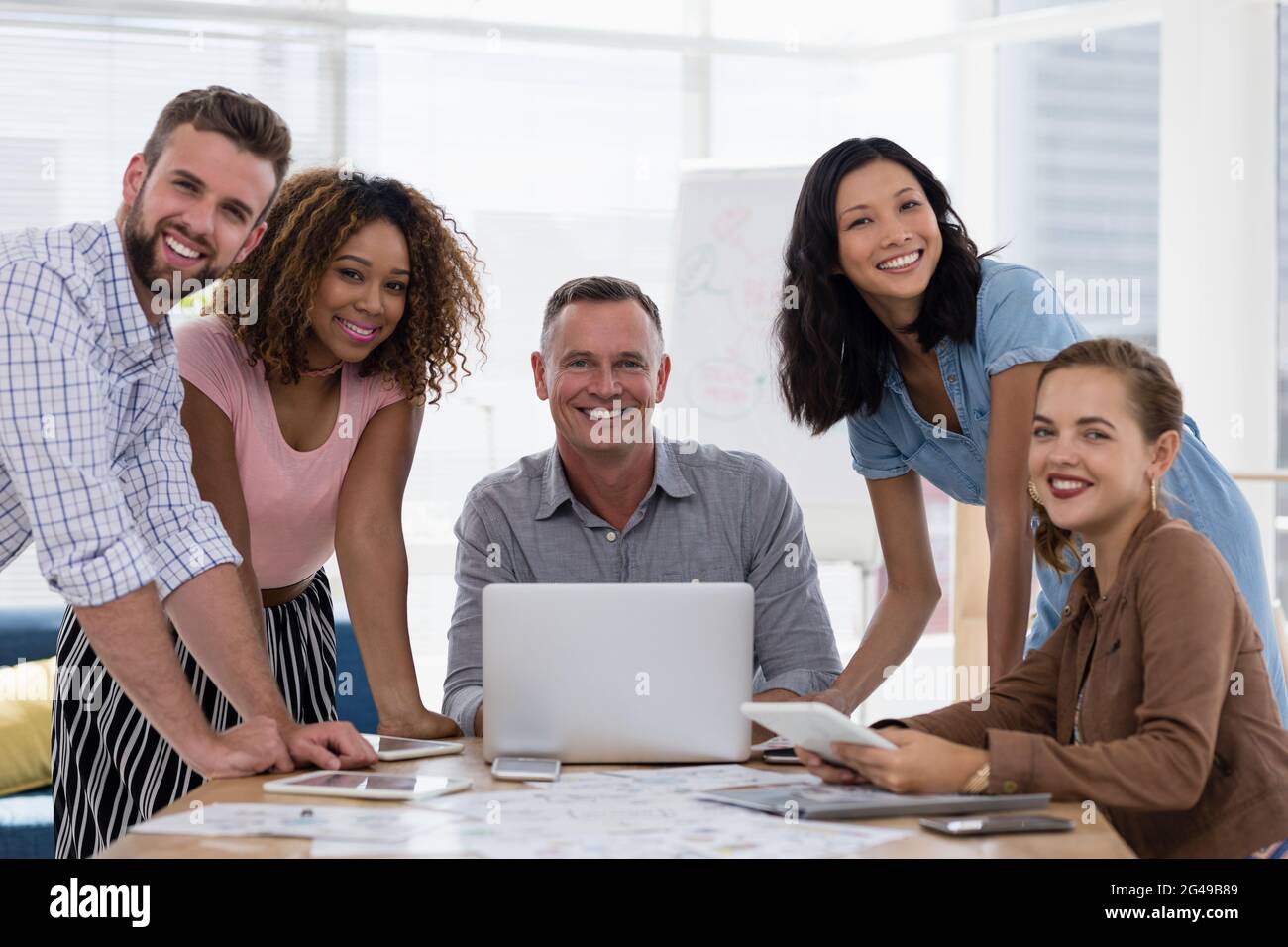 Team of executives working together in the office Stock Photo - Alamy