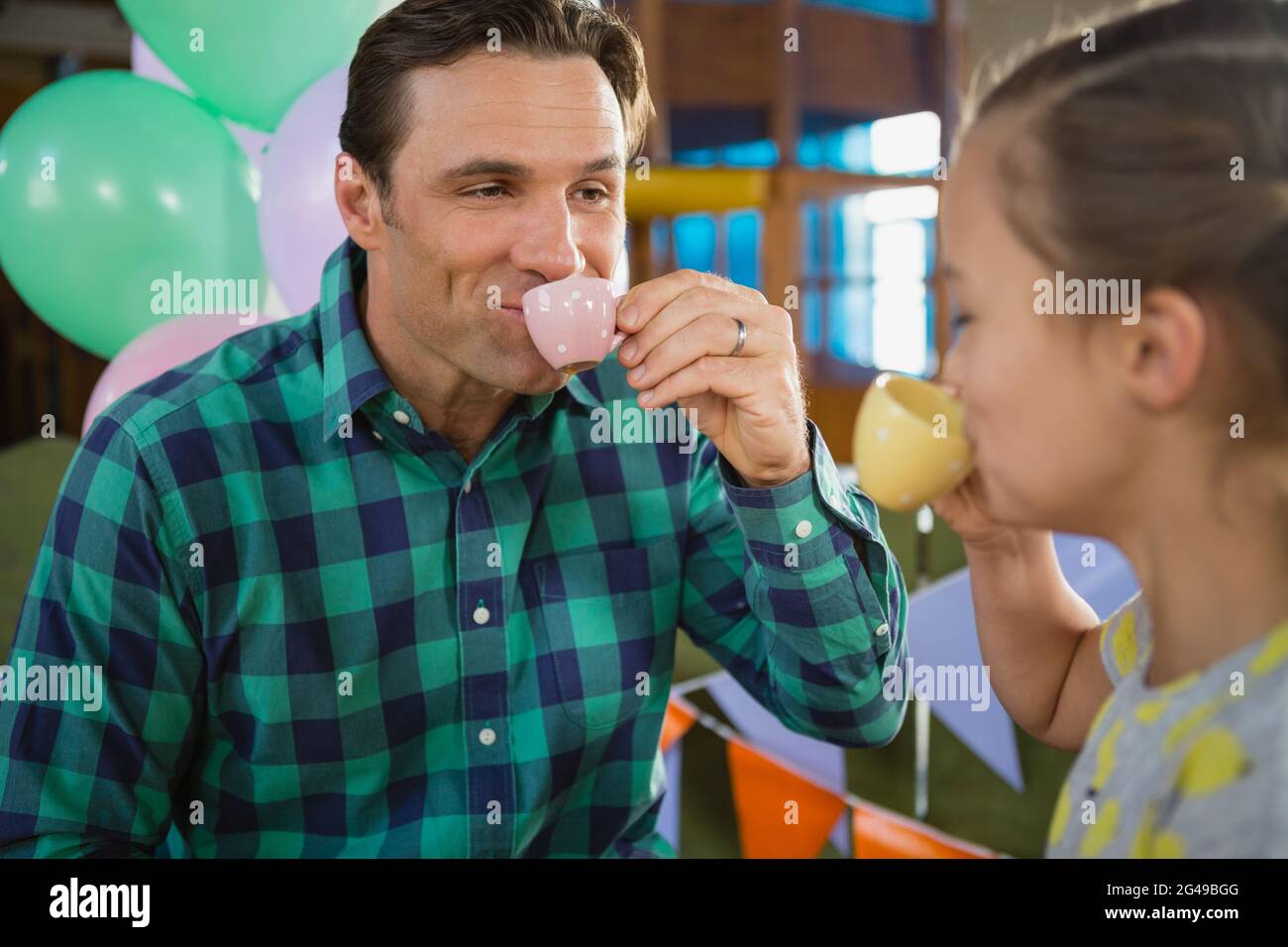 Father and daughter having tea party hi-res stock photography and ...