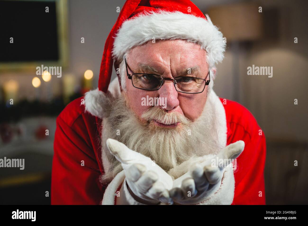 Santa Claus blowing kiss Stock Photo - Alamy