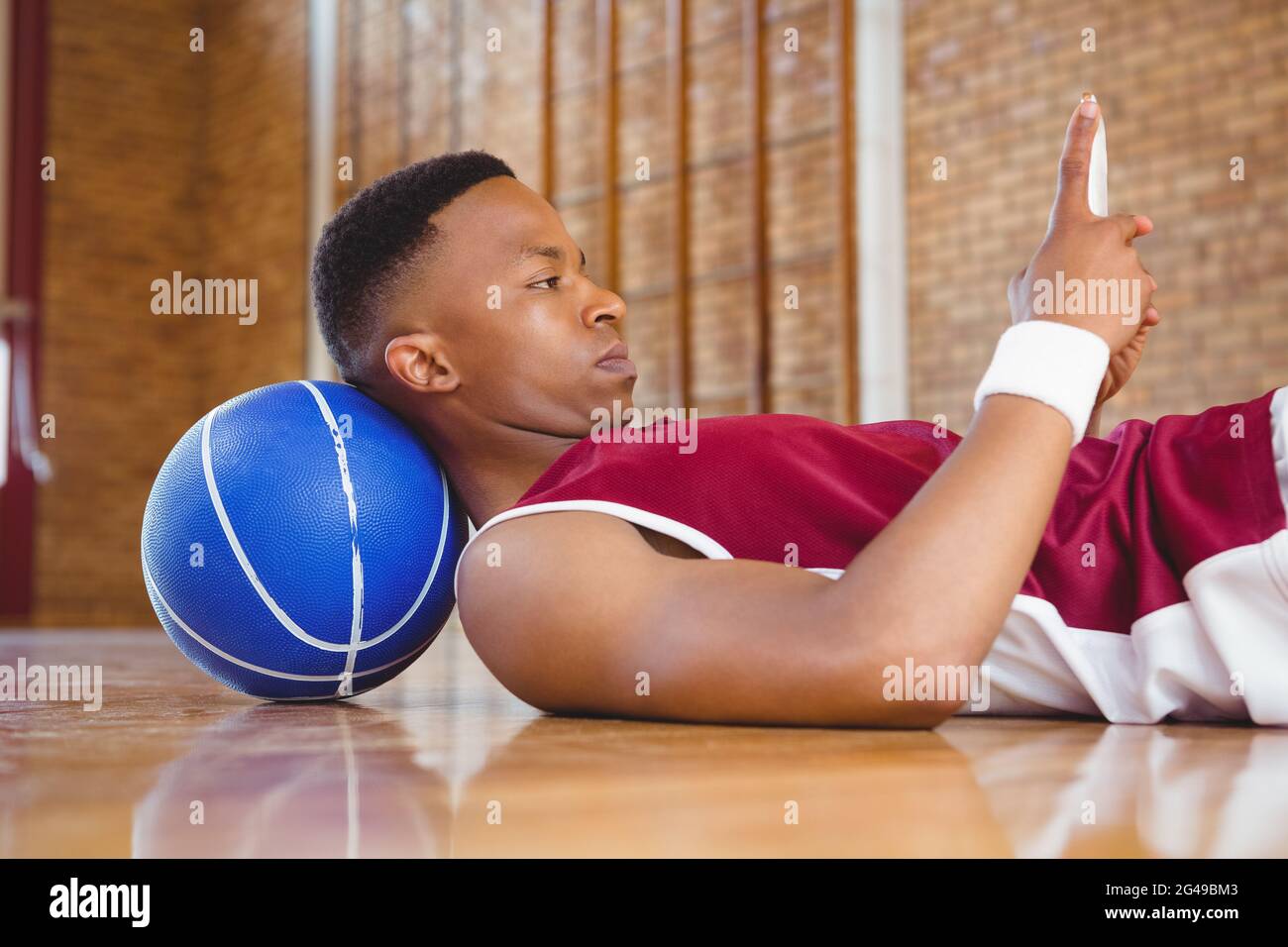 Young man lying on basketball hi-res stock photography and images - Alamy