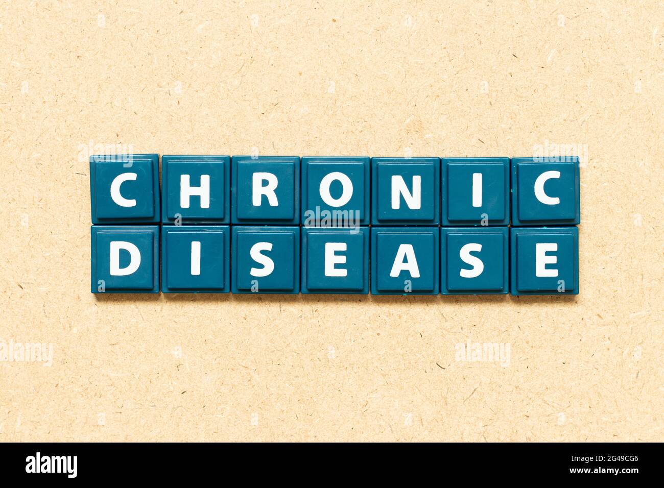 Tile alphabet letter in word chronic disease on wood background Stock ...