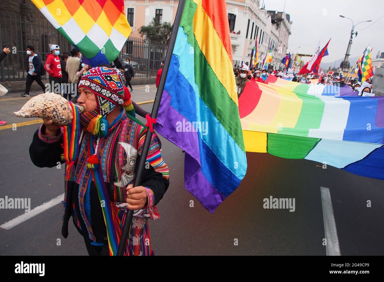 An indigenous man playing a pututu (shell) when thousands took to the ...