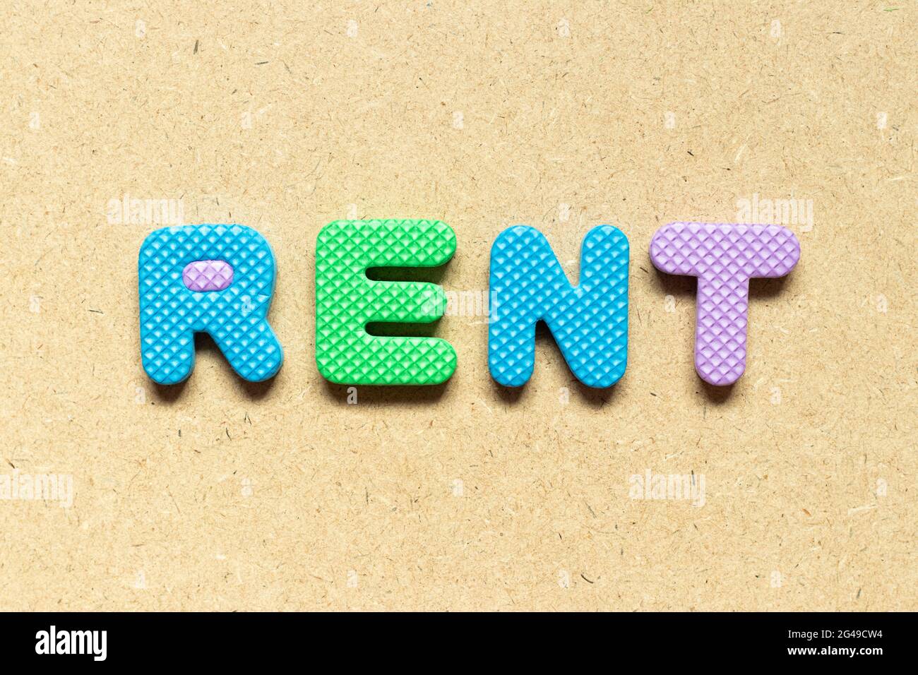 Foam alphabet letter in word rent on wood background Stock Photo - Alamy