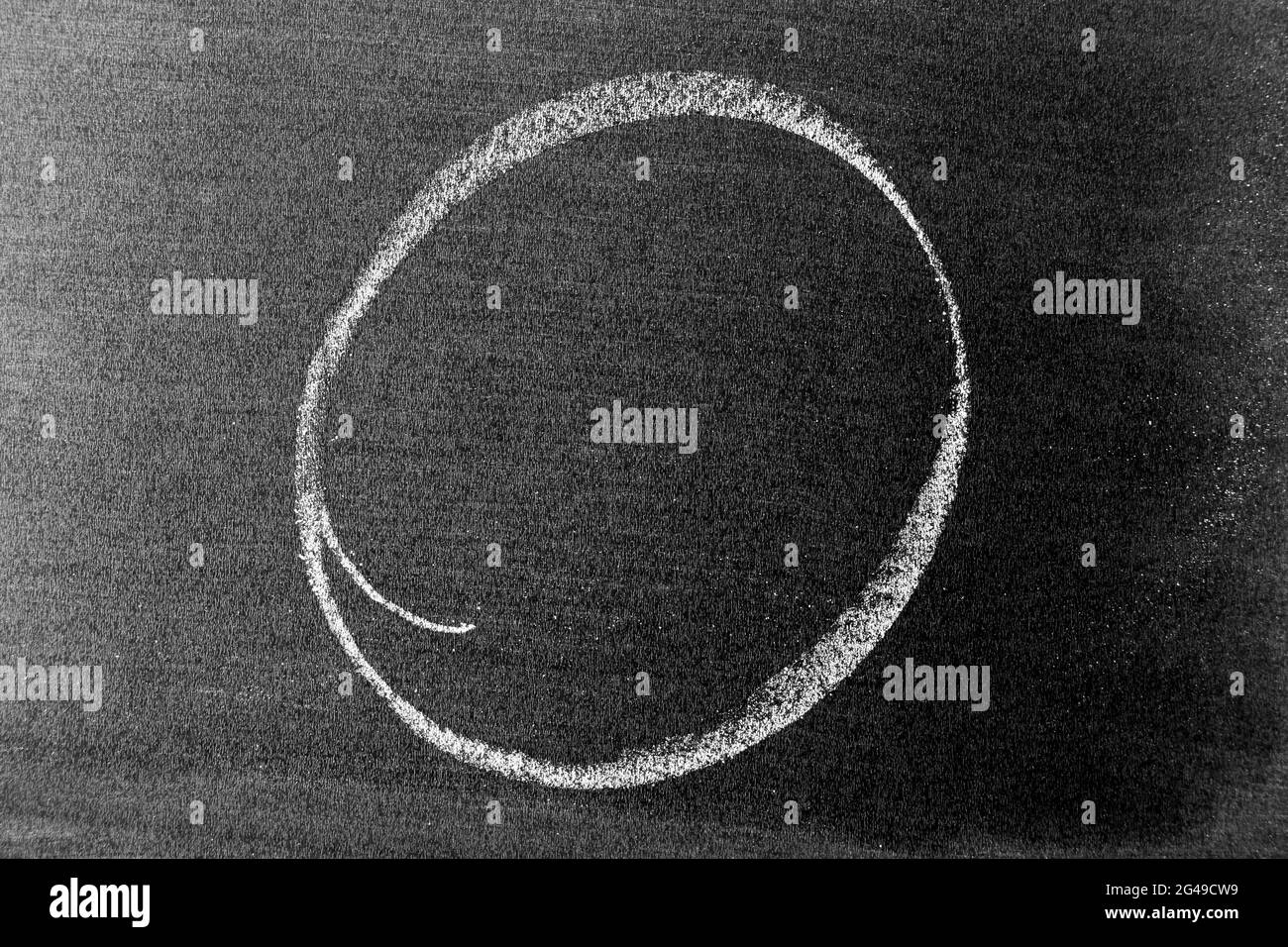 White chalk hand drawing as circle shape on blackboard or chalkboard ...