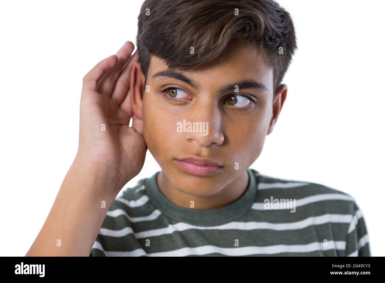 Teenage boy listening secretly with hands behind her ears Stock Photo ...
