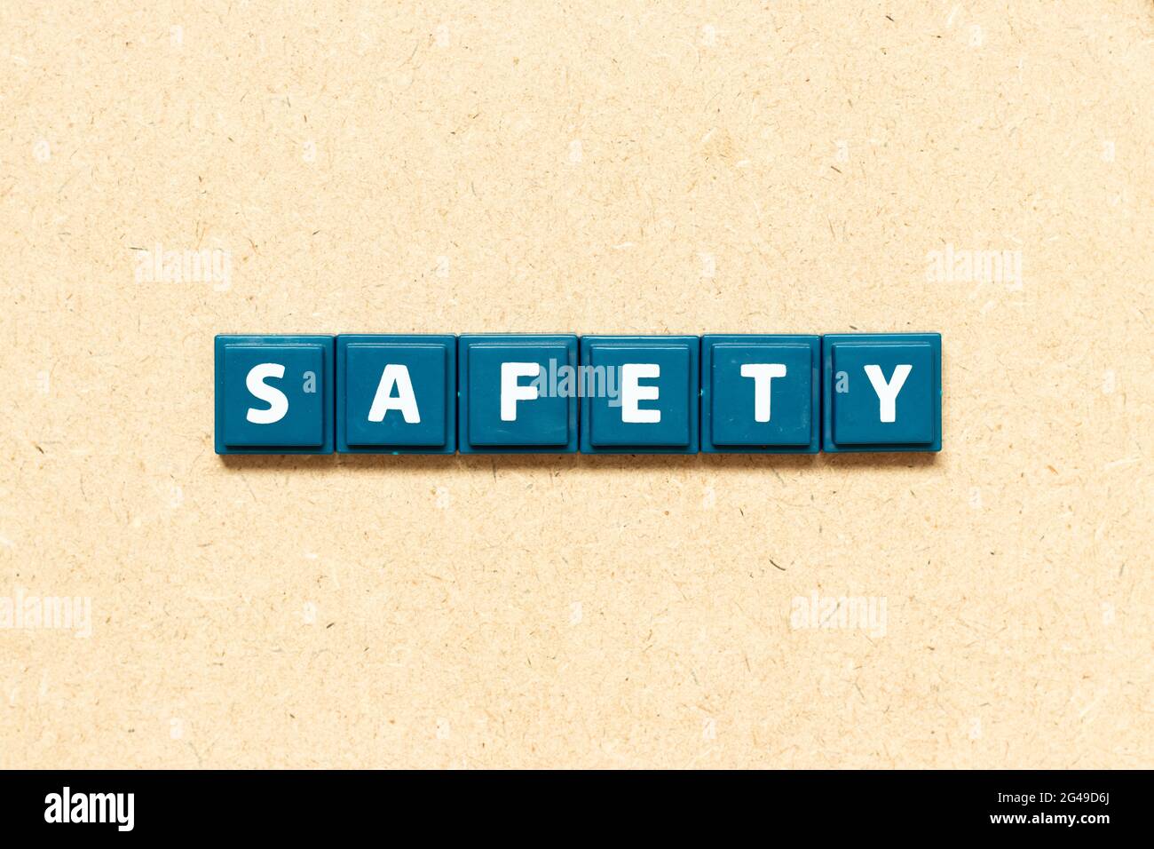 Tile alphabet letter in word safety on wood background Stock Photo - Alamy
