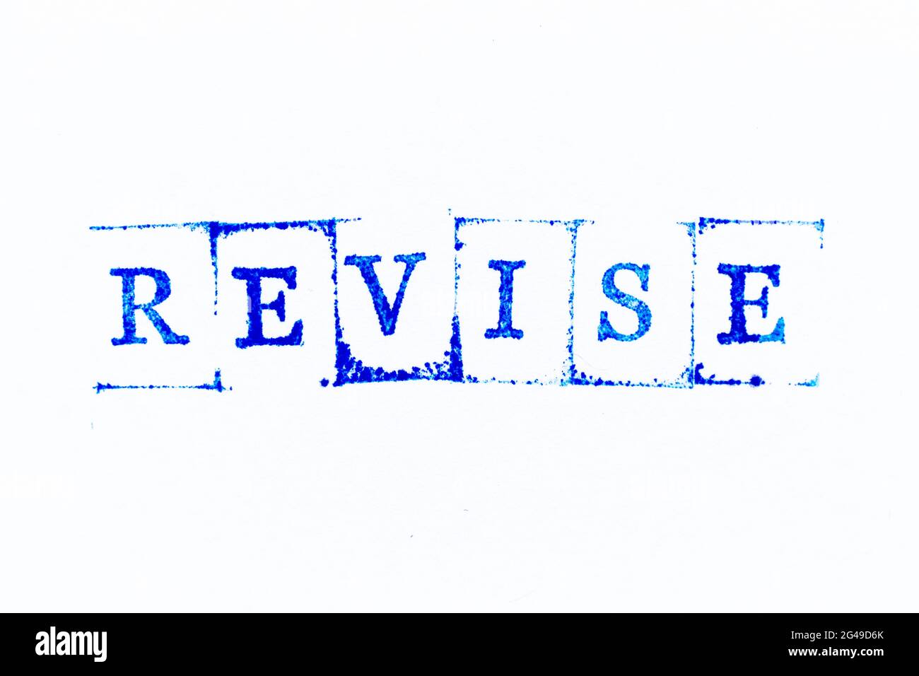 Blue color ink rubber stamp in word revise on white paper background ...