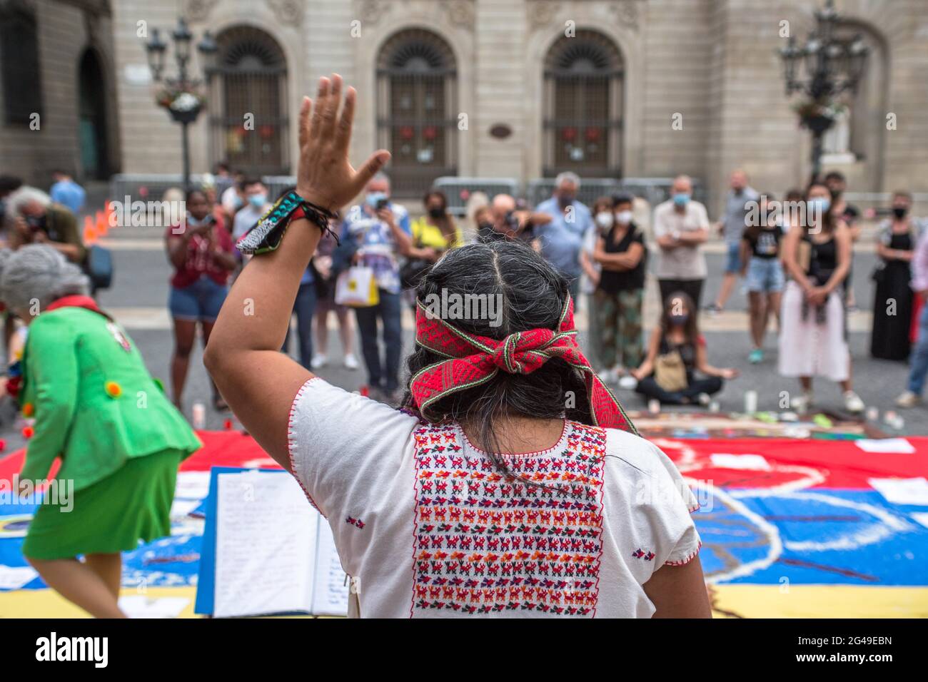 A woman performs Mayan purification ceremony during the demonstration.A ...