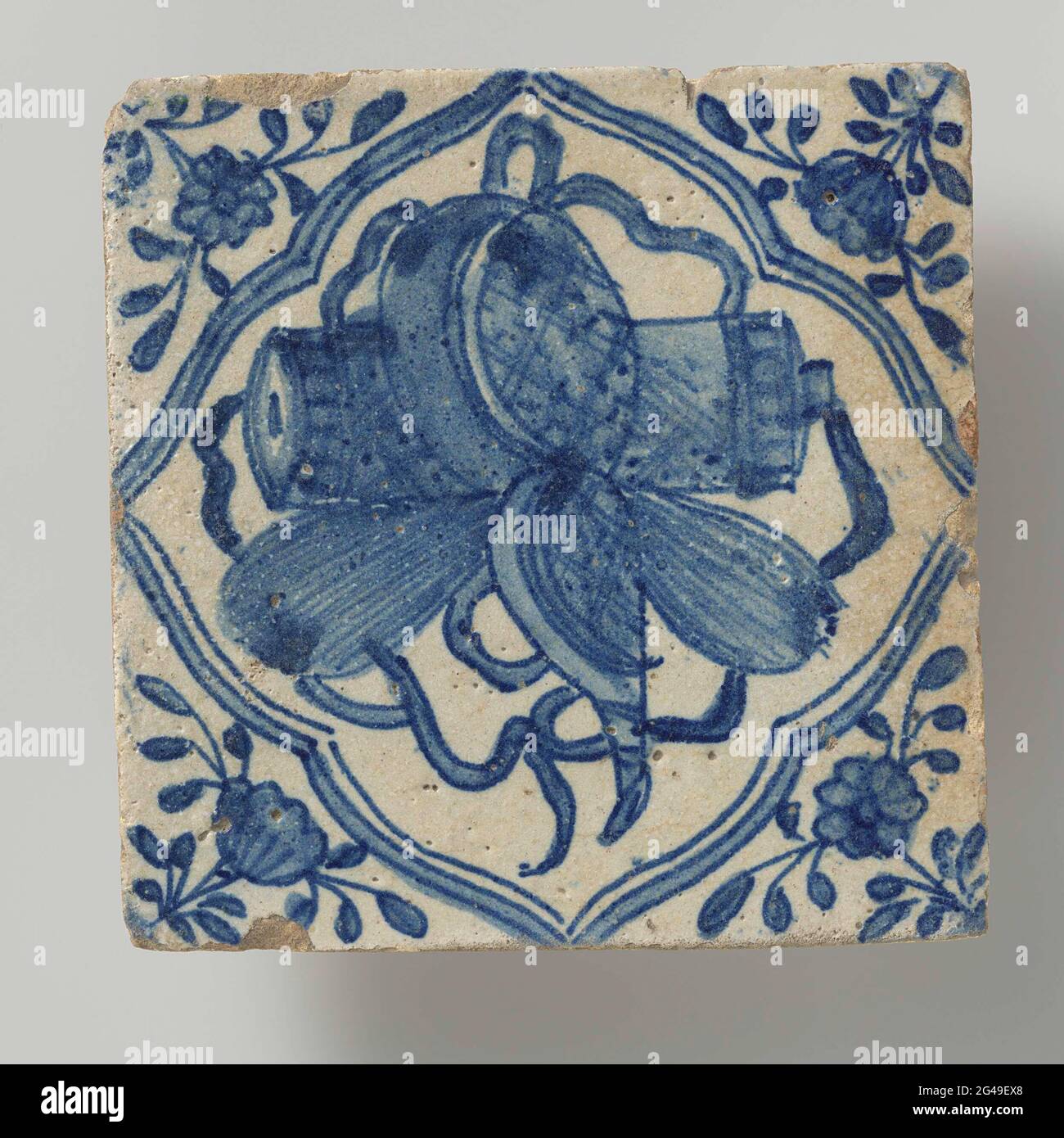 Tile. Tile with blue painted Chinese symbols inside a four-pass frame ...