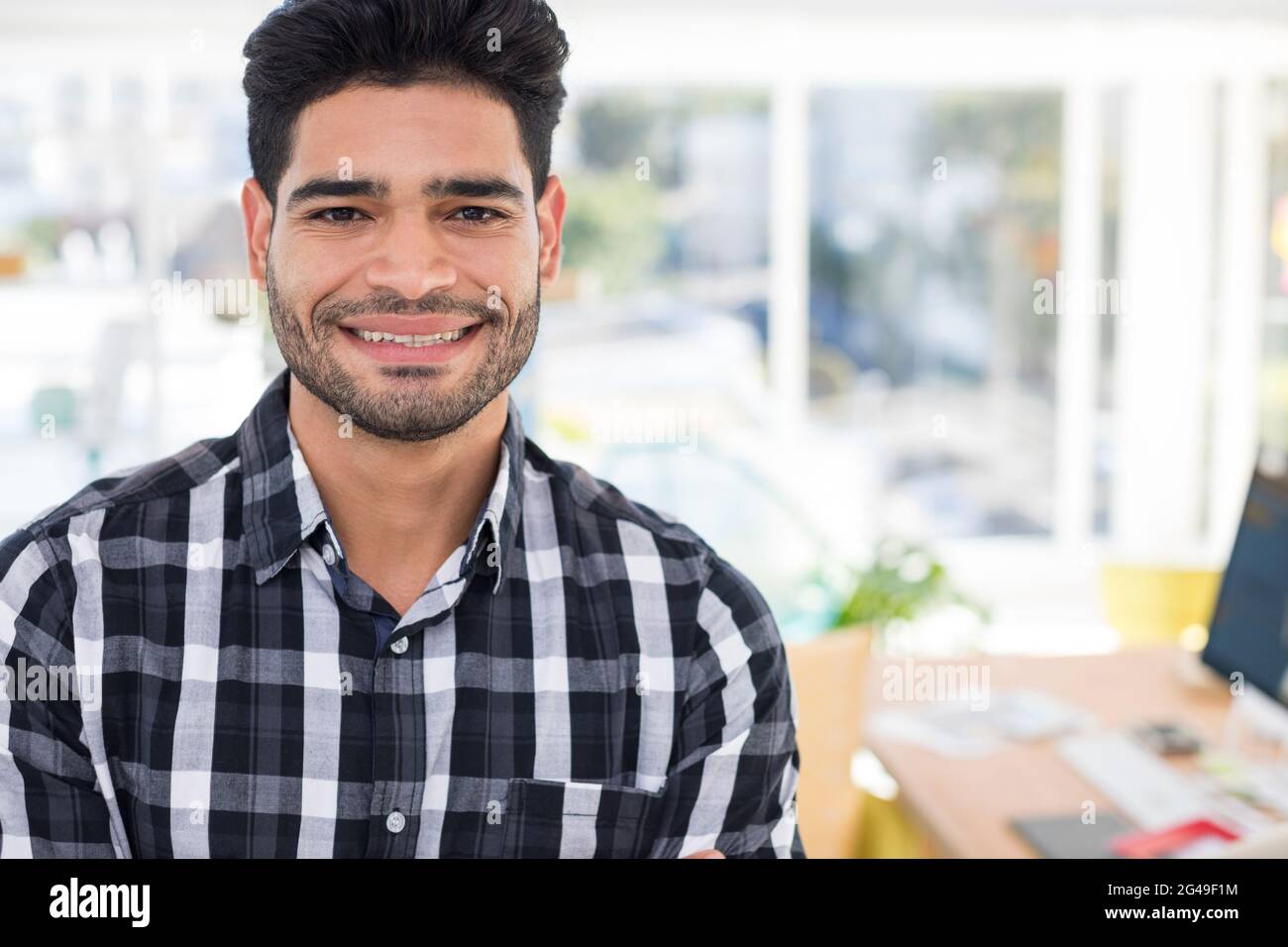 Male executive standing in the office Stock Photo - Alamy