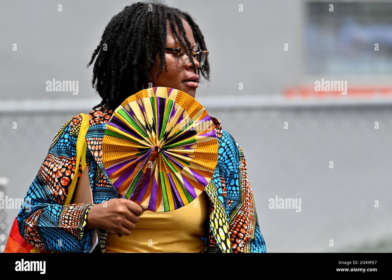 Scranton, United States. 19th June, 2021. A woman fans herself with an ...