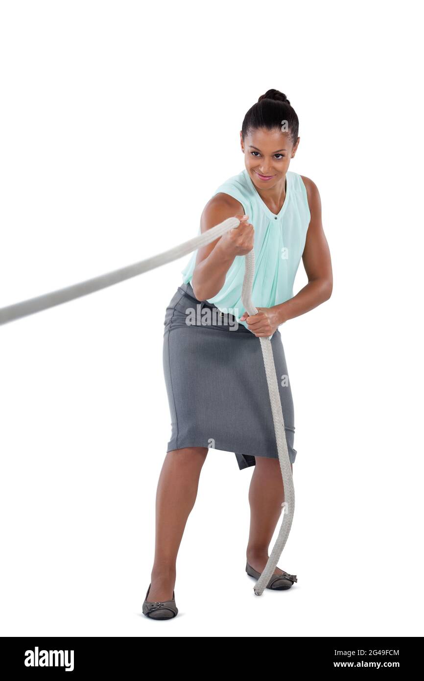 Businesswoman pulling the rope Stock Photo - Alamy