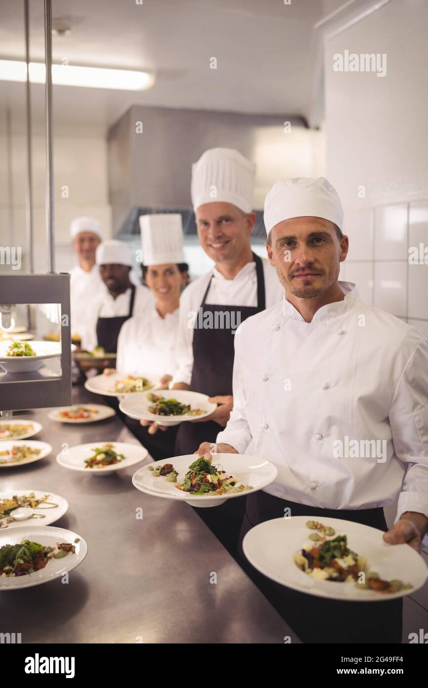 Chefs presenting food plates Stock Photo - Alamy