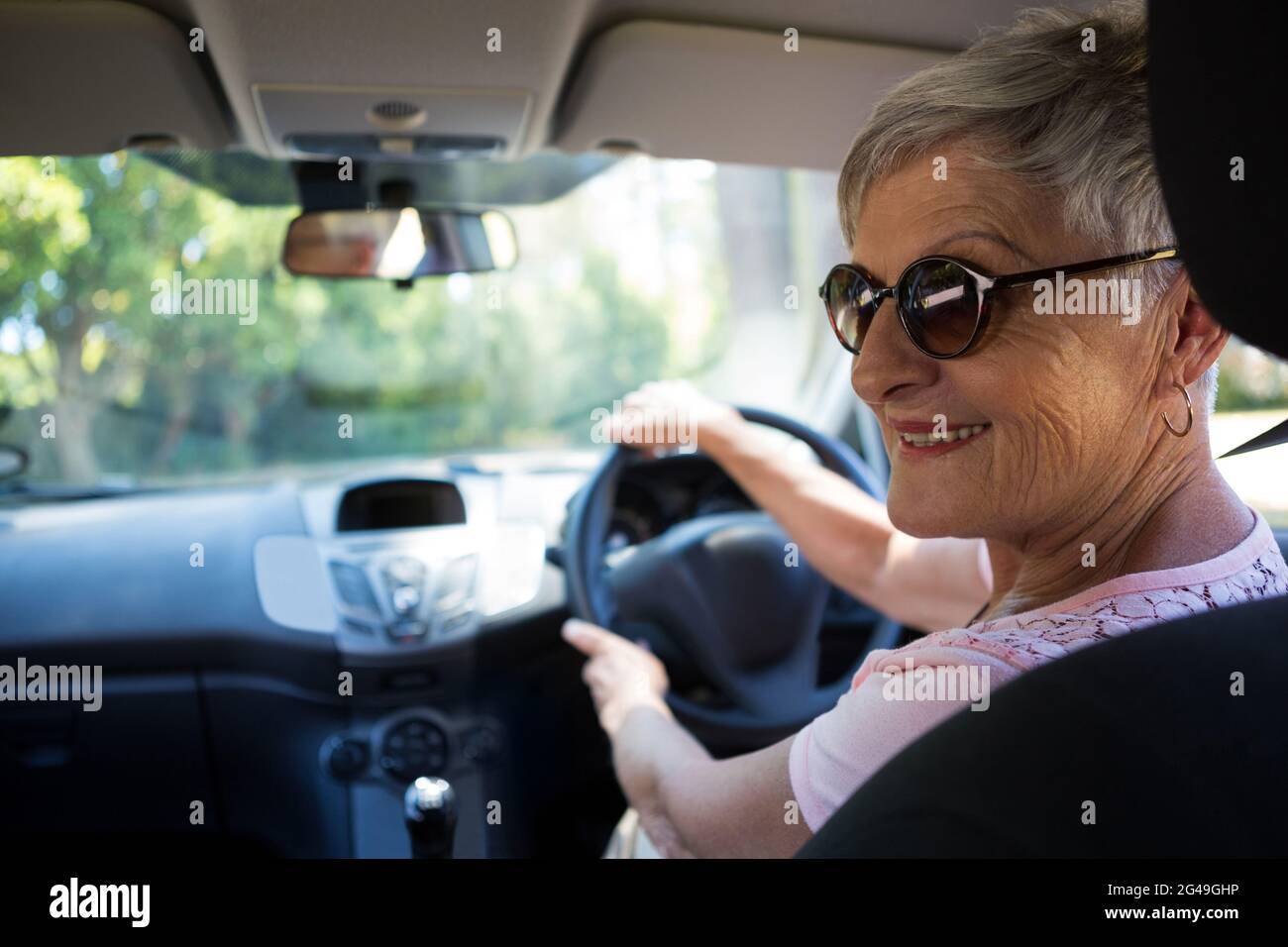 Senior woman driving a car Stock Photo - Alamy