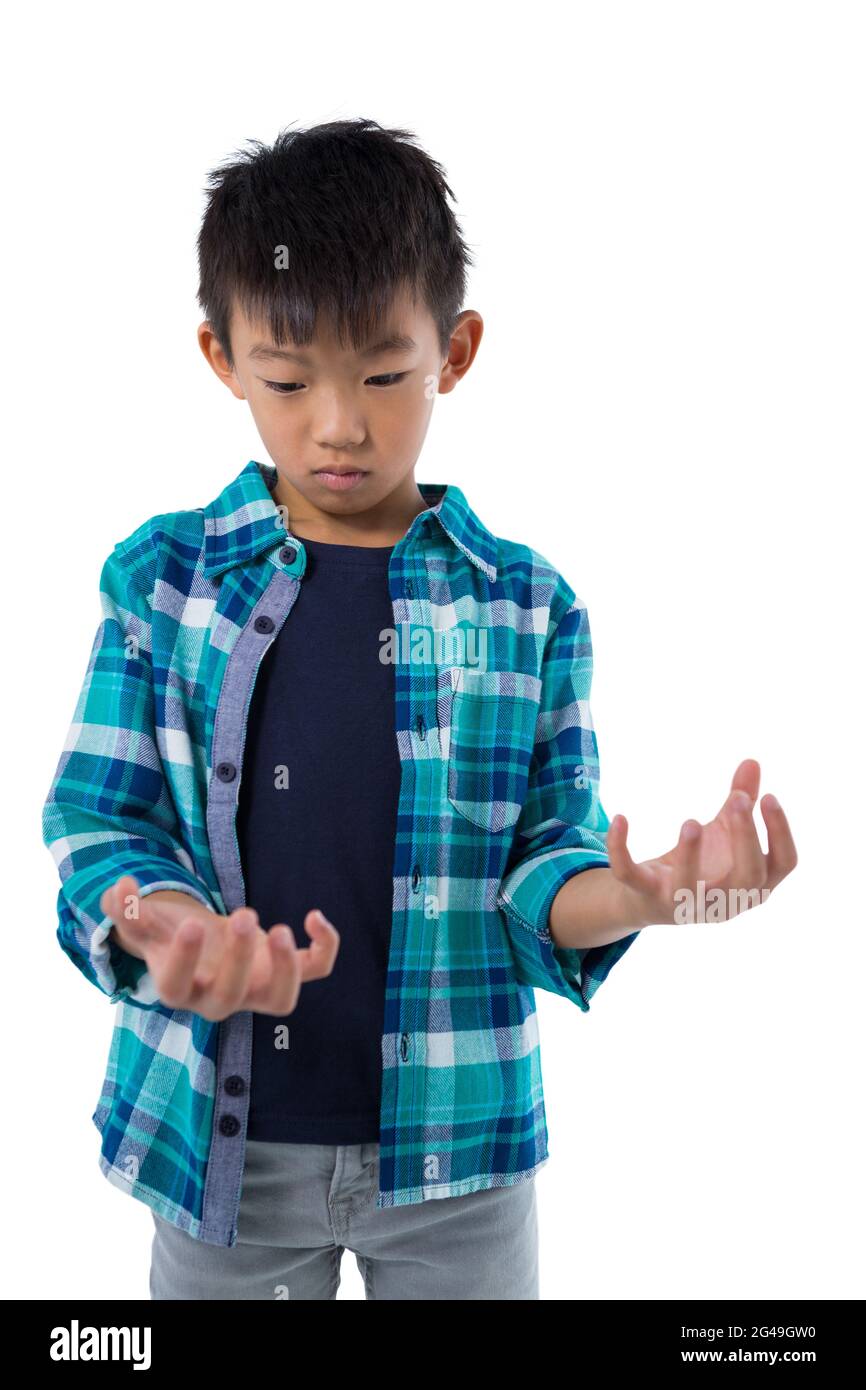 Boy pretending to hold invisible object Stock Photo - Alamy