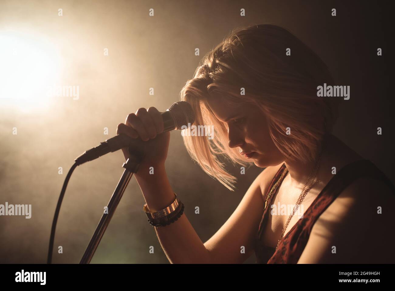 Confident female singer singing in hi-res stock photography and images ...