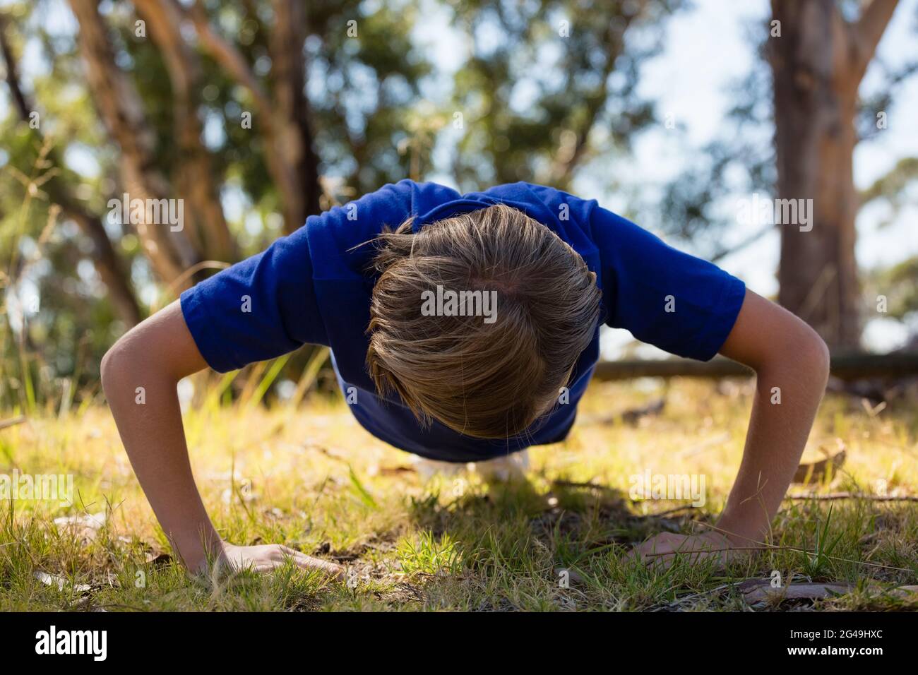 Girl exercising during obstacle course training Stock Photo - Alamy