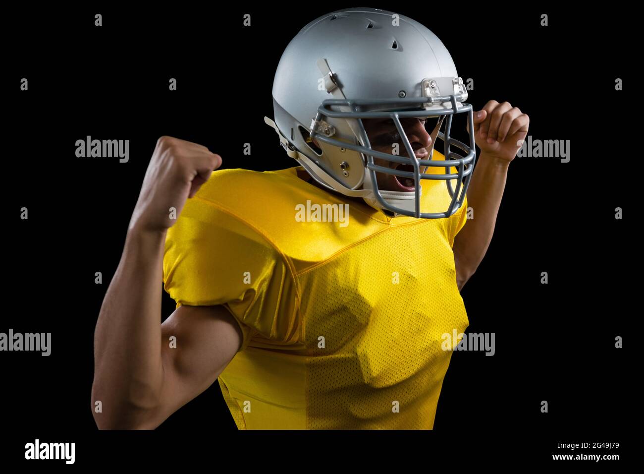 American football player flexing his muscles Stock Photo - Alamy