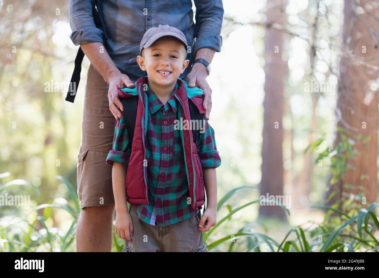 Portrait of happy boy standing with father Stock Photo - Alamy