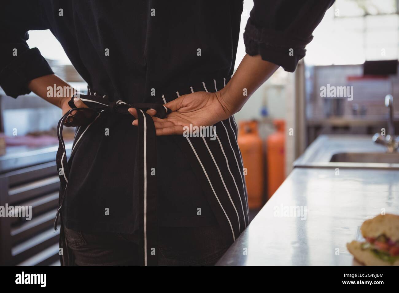 Man wearing striped apron hi-res stock photography and images - Alamy