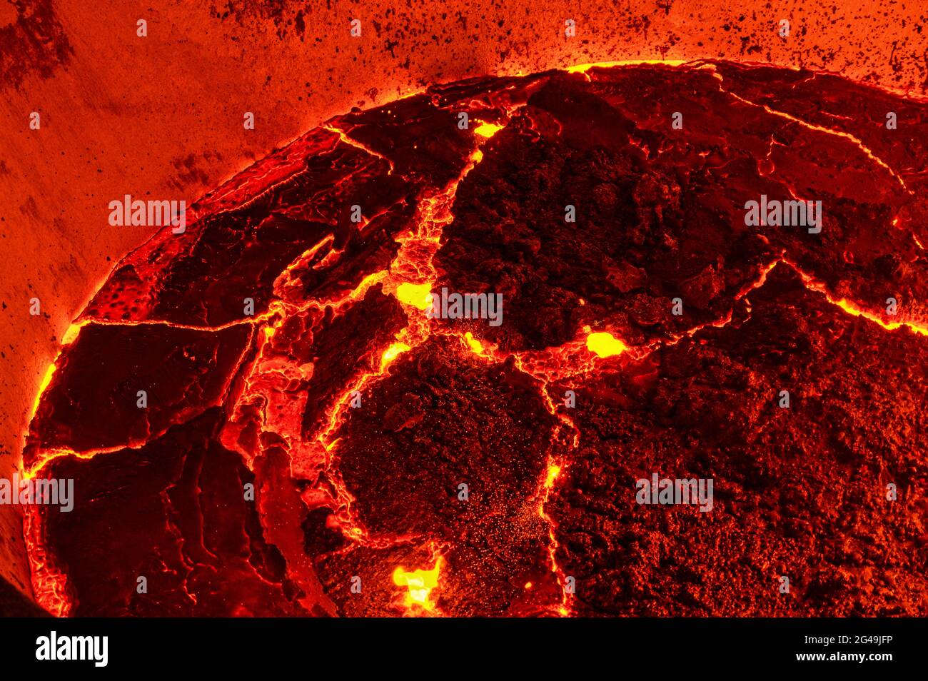 The surface of a hot liquid slag in a metallurgical ladle. Thick crust ...