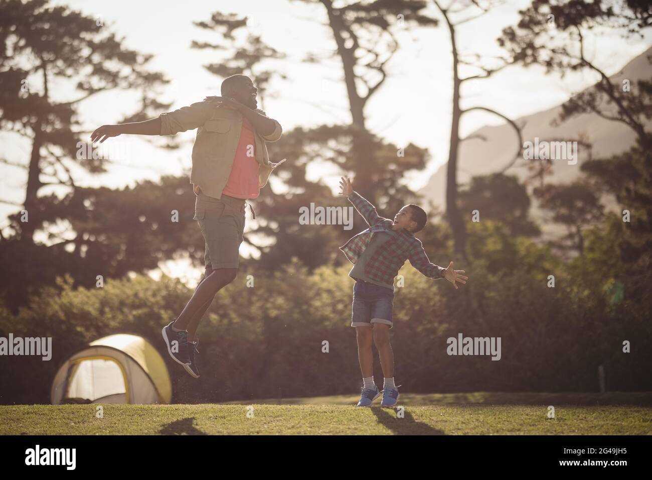 Father and son man and boy jump in hi-res stock photography and images ...