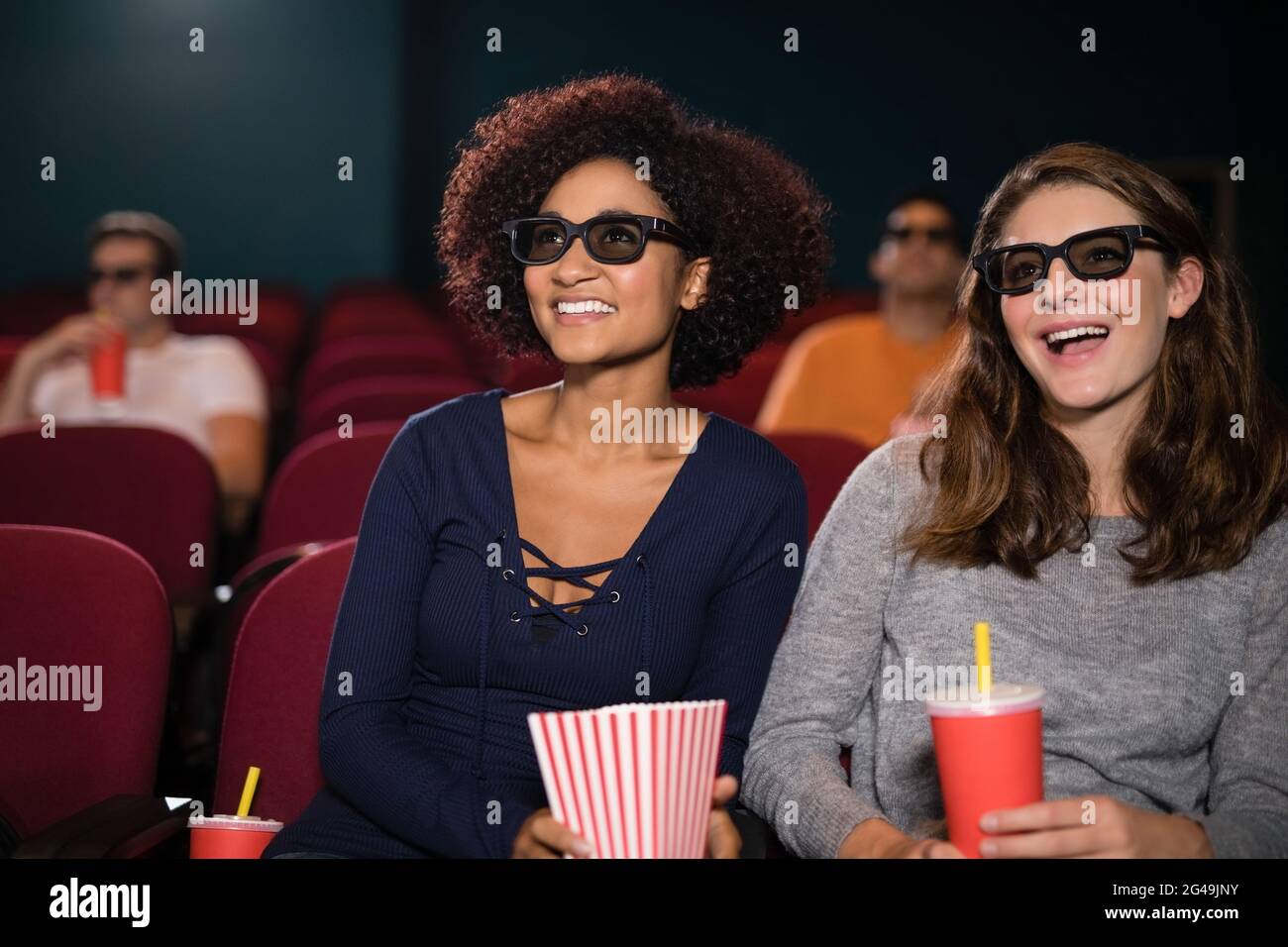 Friends watching movie Stock Photo - Alamy