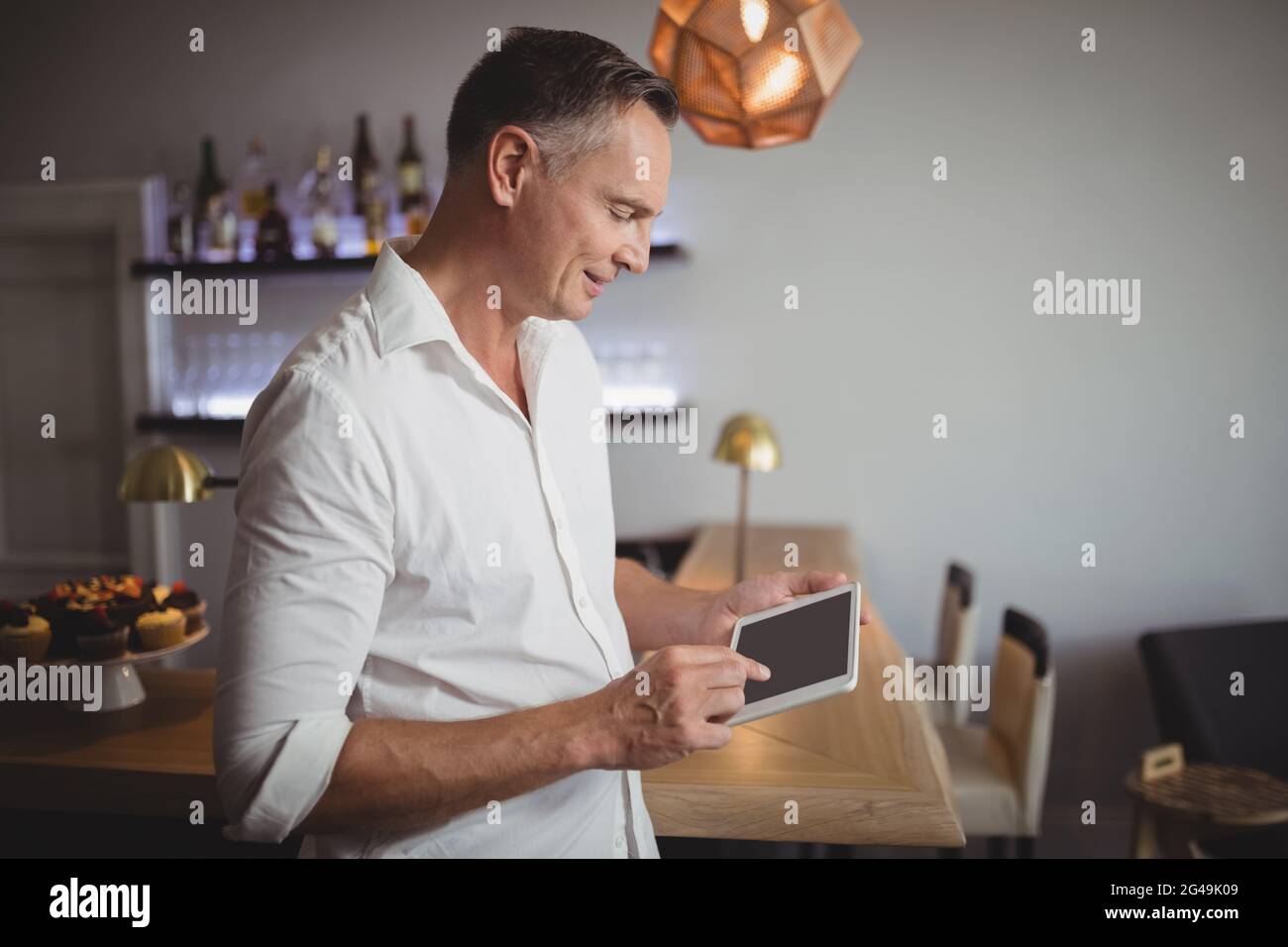 Man using digital tablet Stock Photo - Alamy