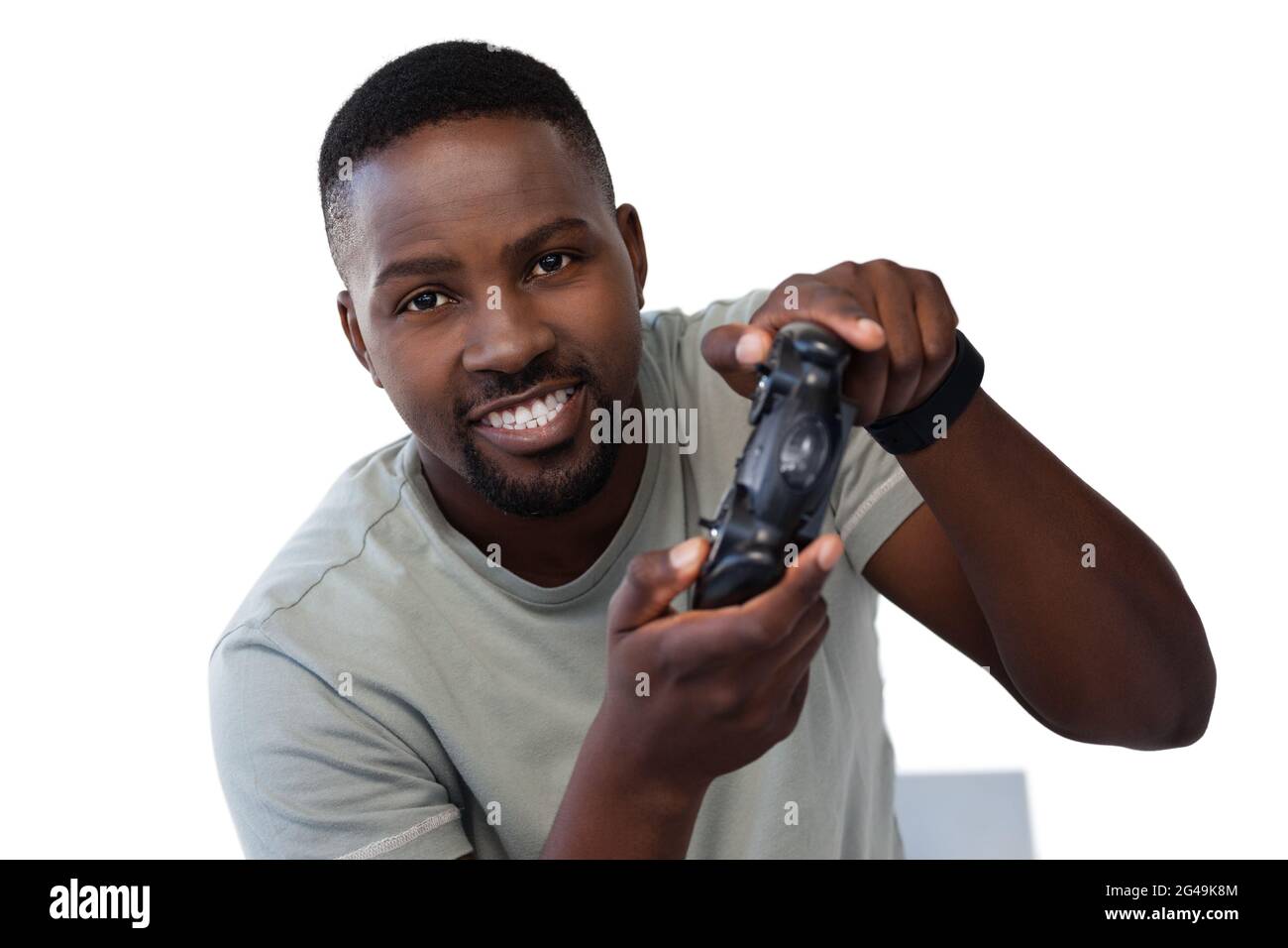 Man playing video game against white background Stock Photo - Alamy
