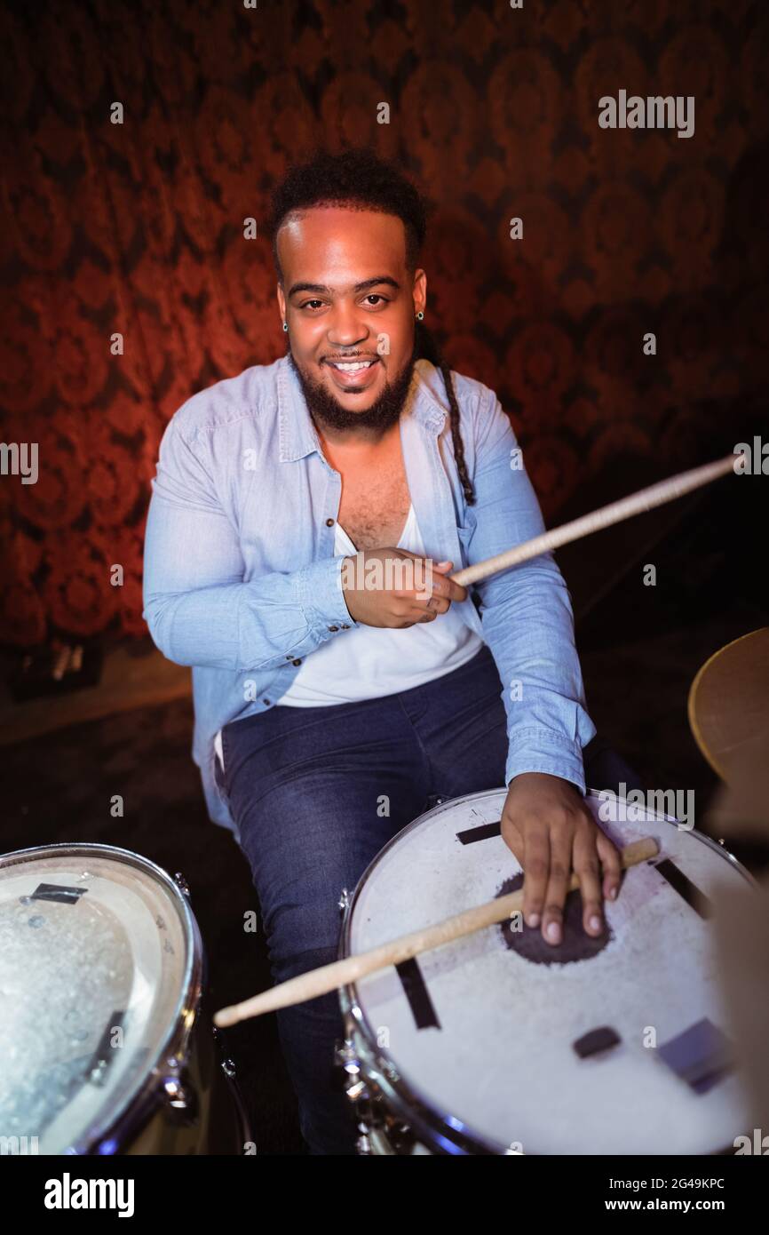 Portrait of drummer performing at nightclub Stock Photo - Alamy