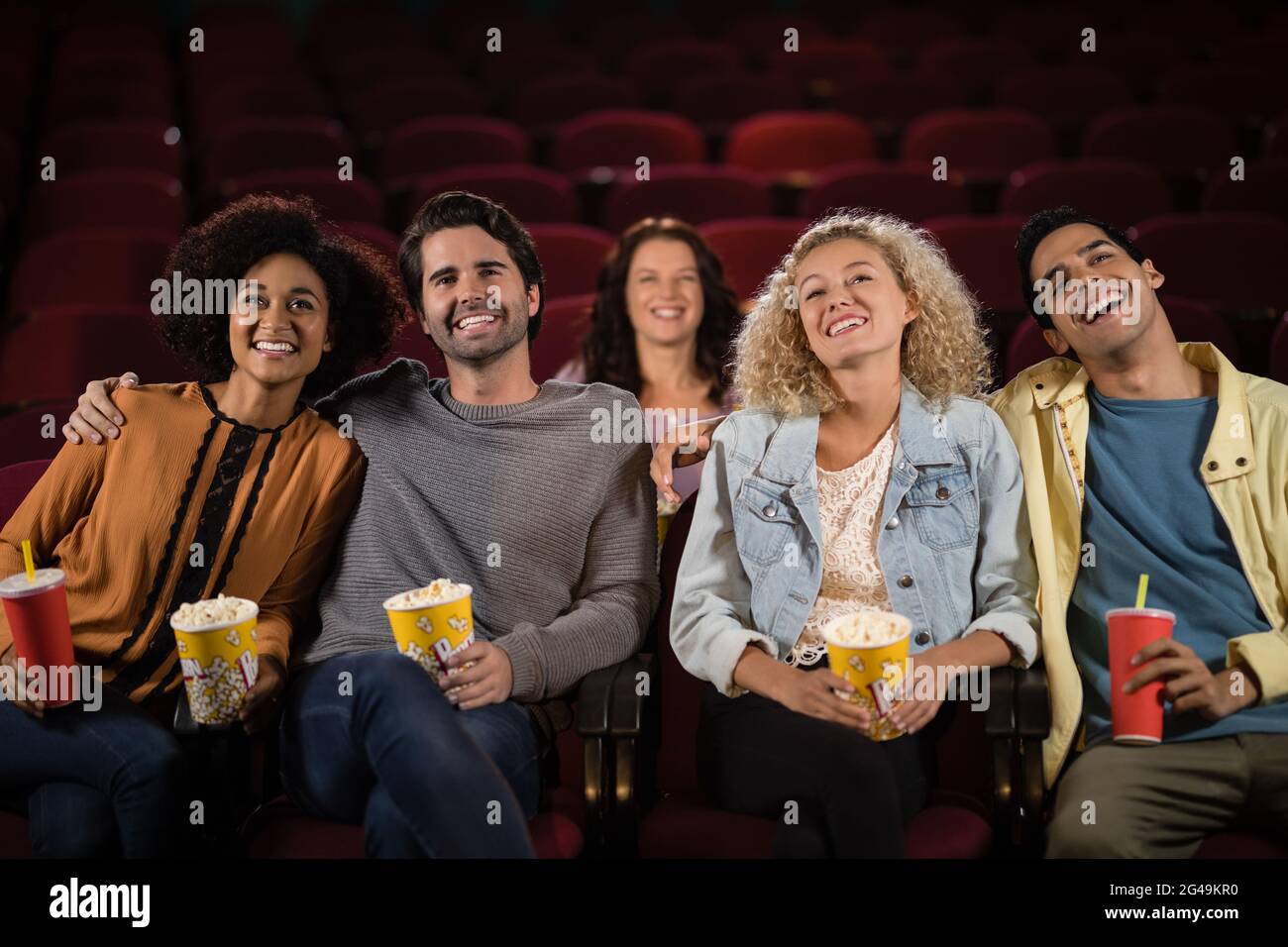 Friends watching movie Stock Photo - Alamy