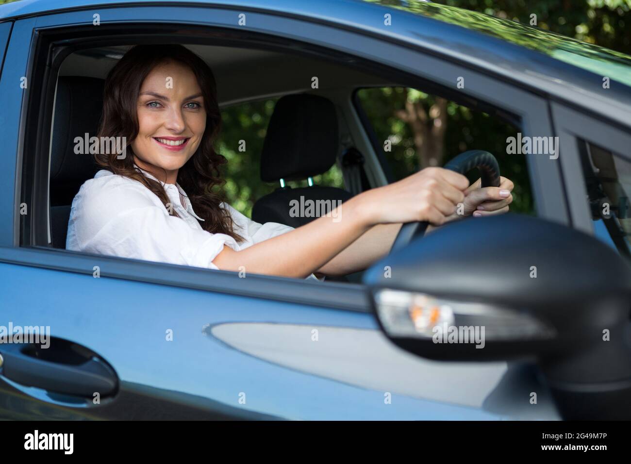 Beautiful woman driving a car Stock Photo - Alamy