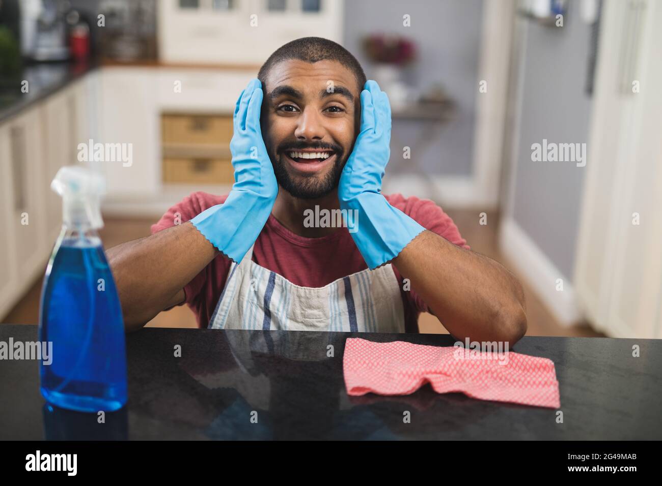 Portrait of surprised man by marble counter in kitchen Stock Photo - Alamy