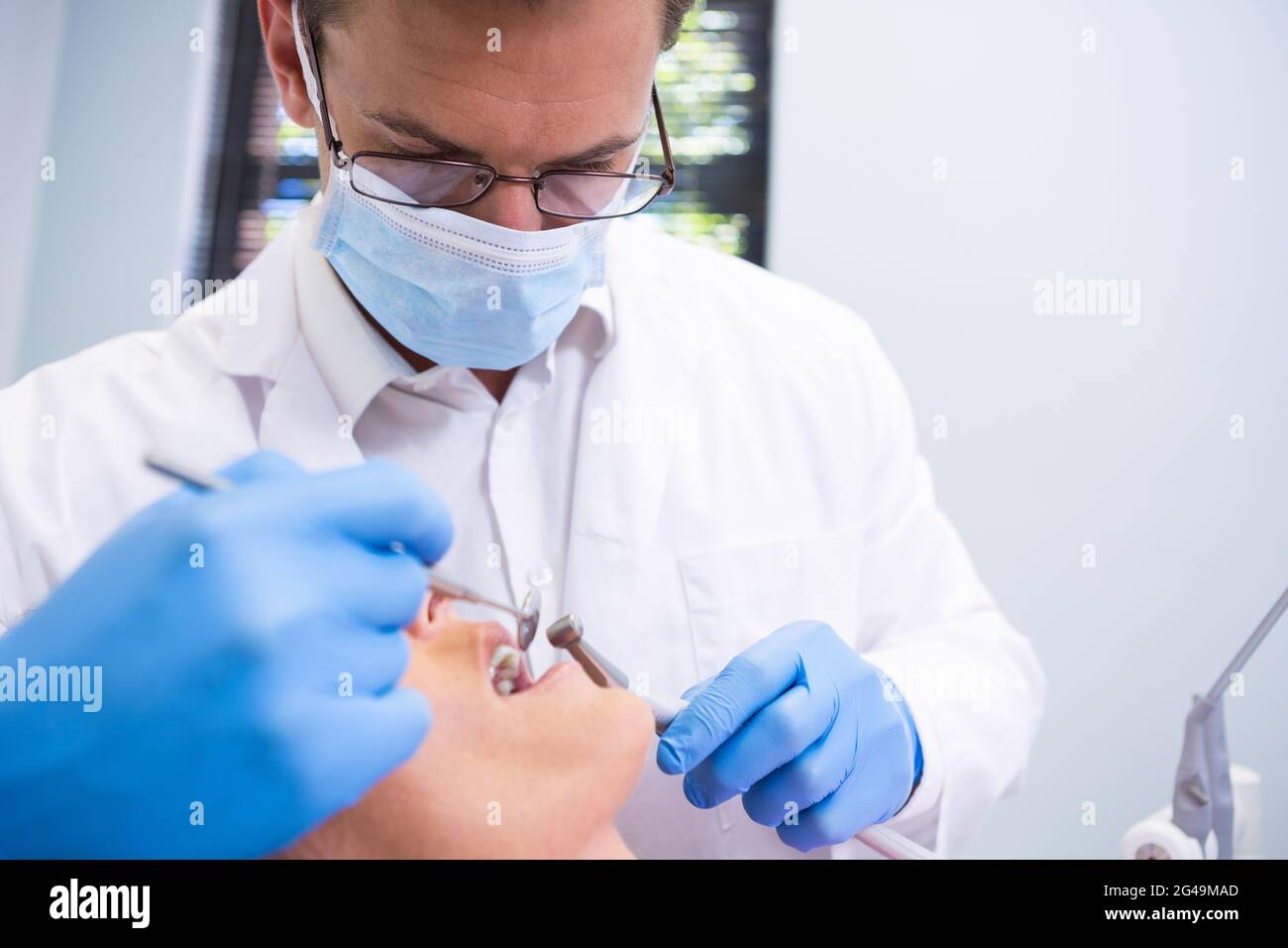 Close up dental assistant examining hi-res stock photography and images ...